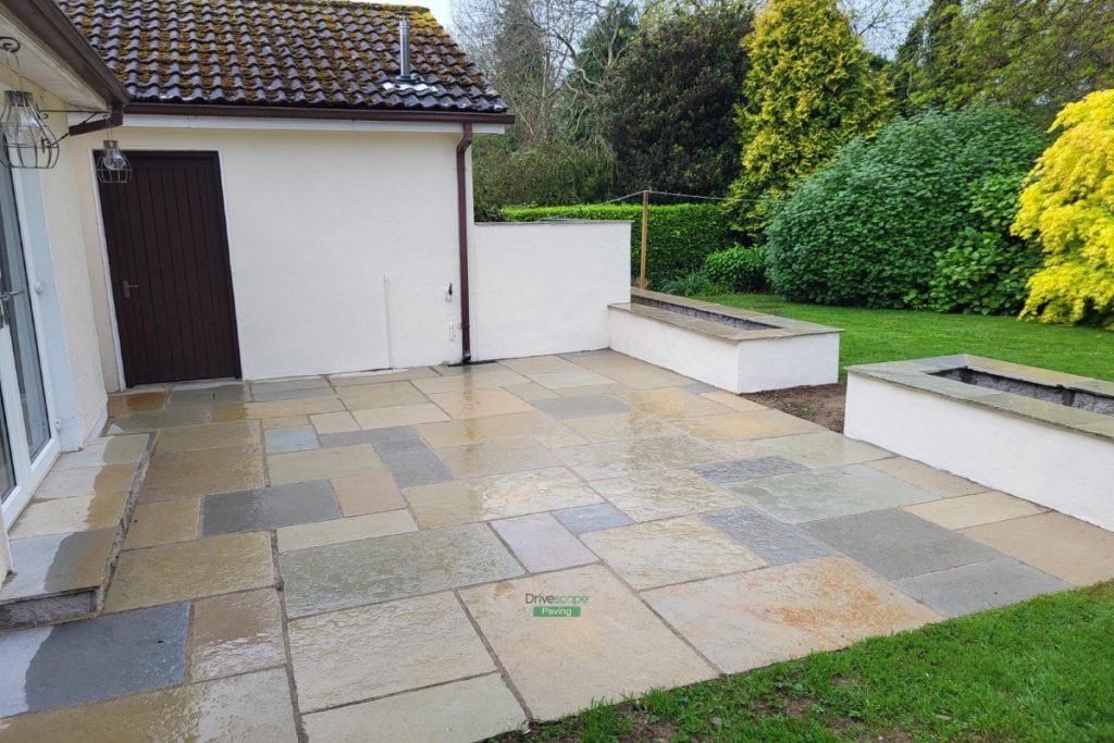 Limestone Paved Patio with Flowerbeds and New Oil Tank Wall in Ashford ...